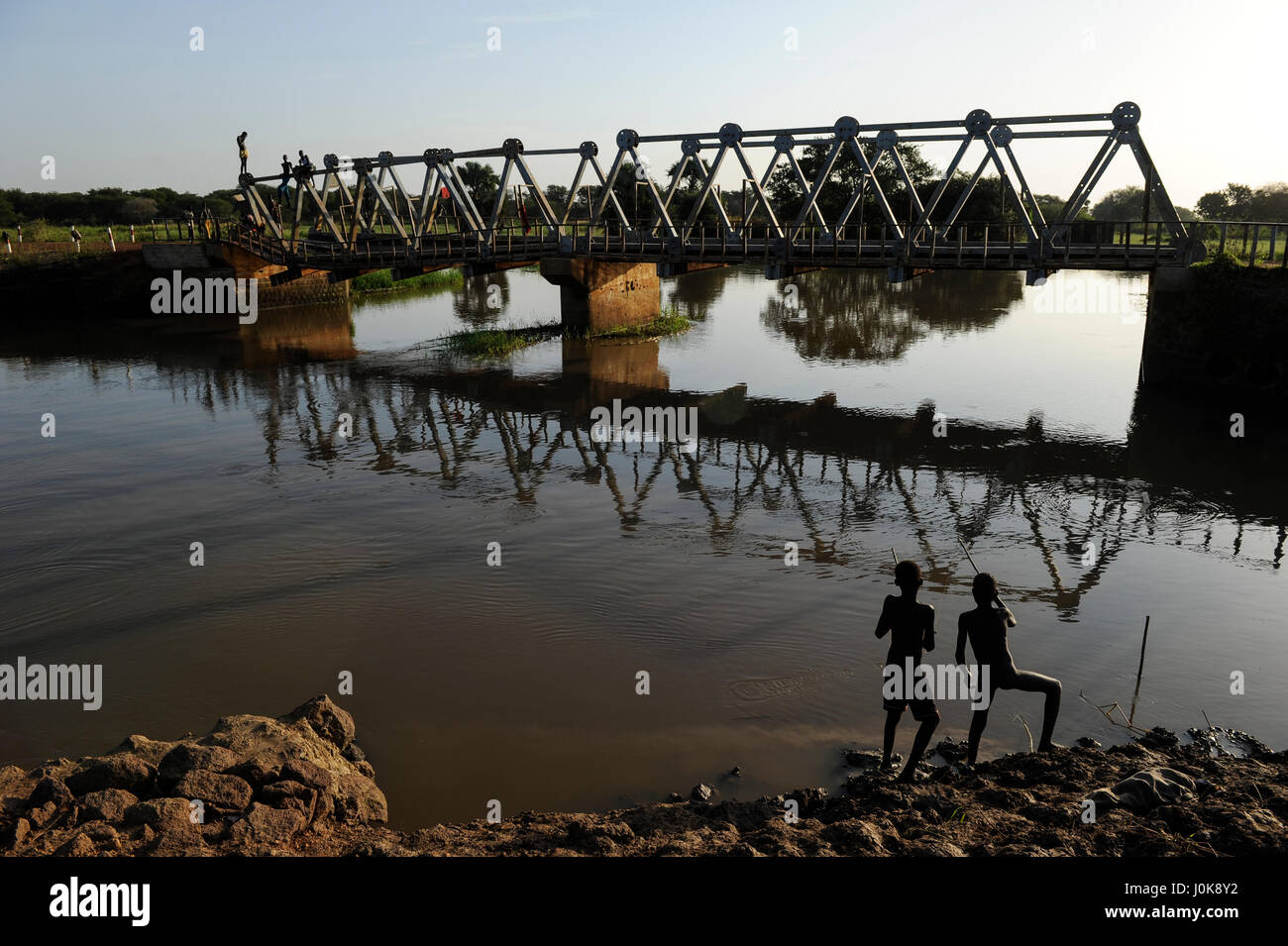 SOUTH SUDAN Lakes state, Rumbek, boys catching fish at Bamam bridge ...