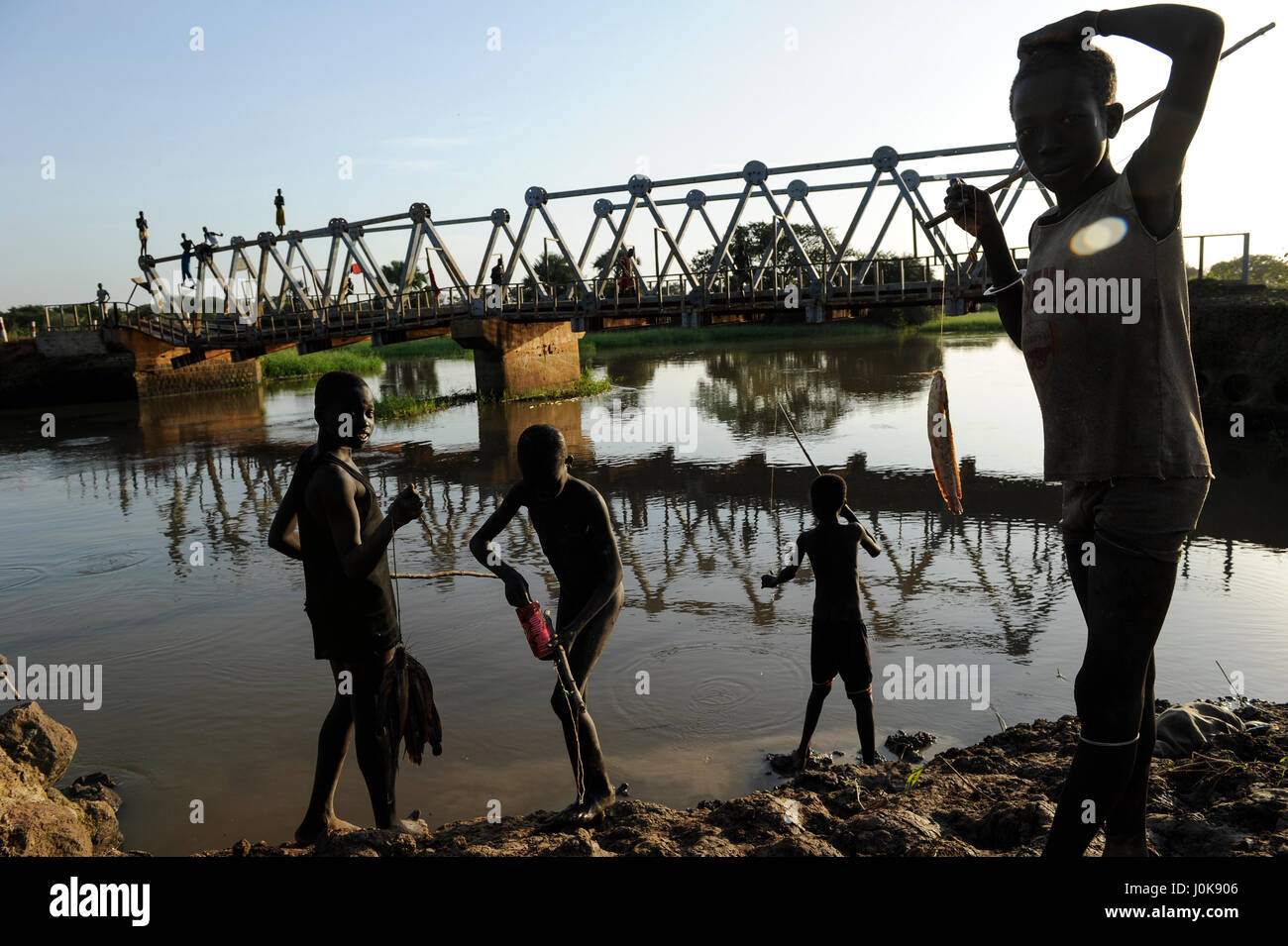 SOUTH SUDAN Lakes state, Rumbek, boys catching fish at Bamam bridge ...