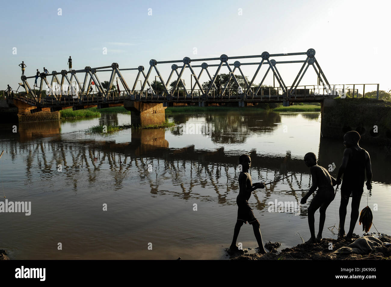SOUTH SUDAN Lakes state, Rumbek, boys catching fish at Bamam bridge ...
