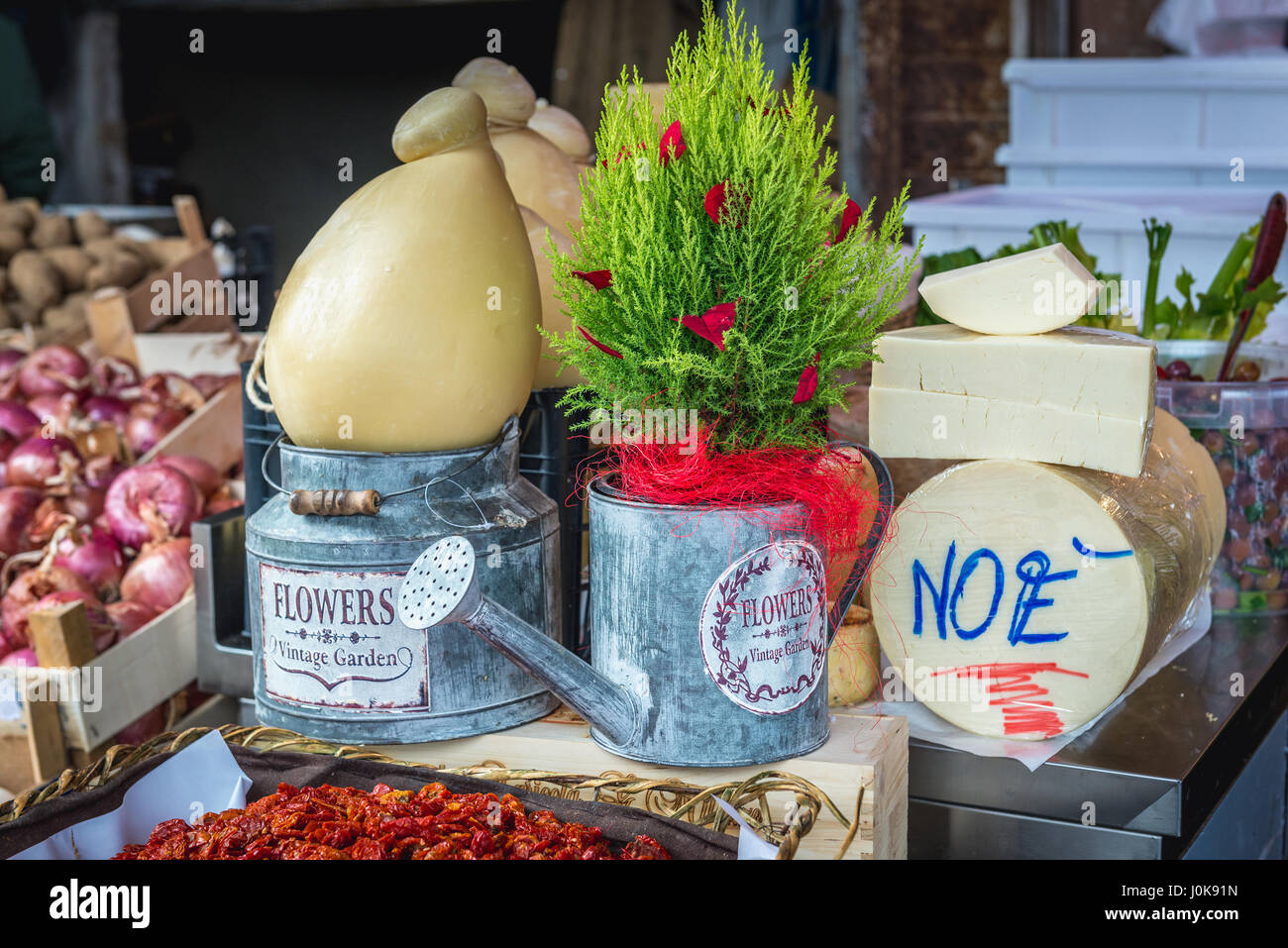 Stand with varieties of cheese for sale on daily outdoor market in ...