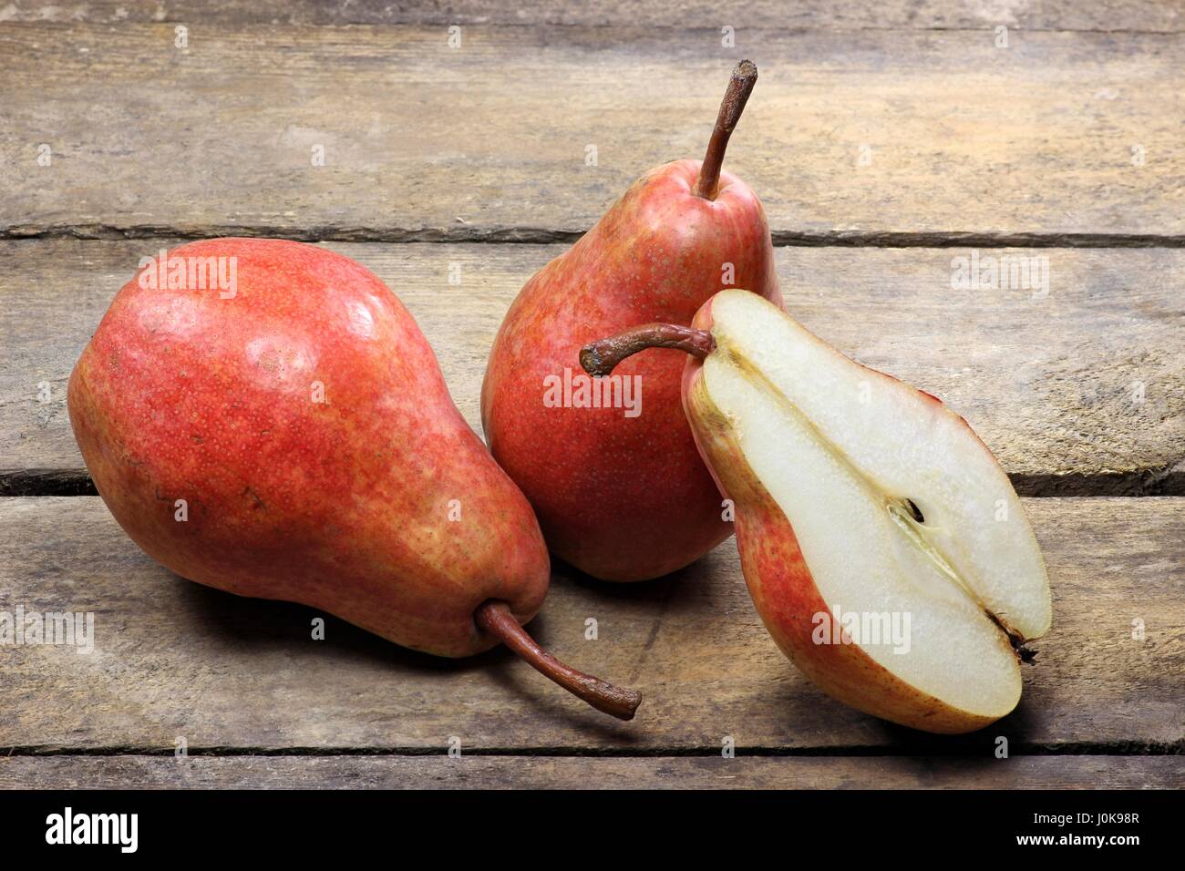 pears (variety Red Bartlett) on wooden background Stock Photo - Alamy