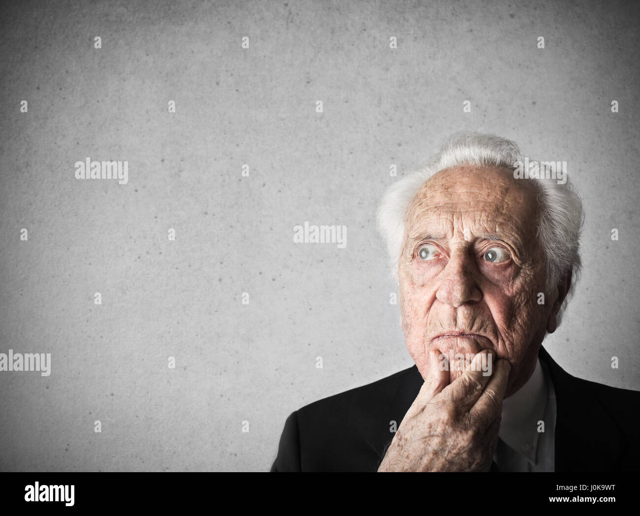 Old man thinking Stock Photo - Alamy