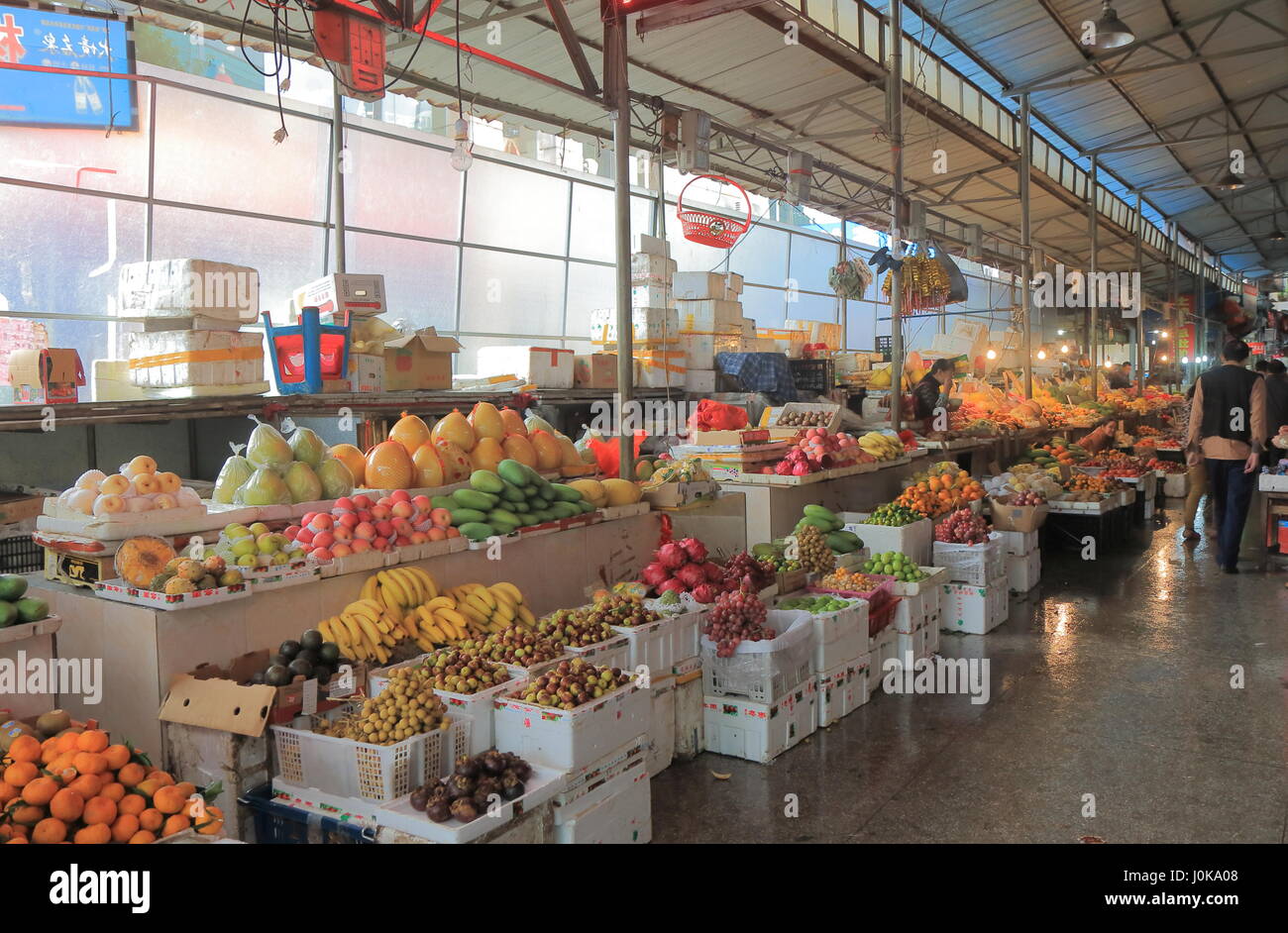 People visit Local market fruits shop in Guilin China Stock Photo - Alamy