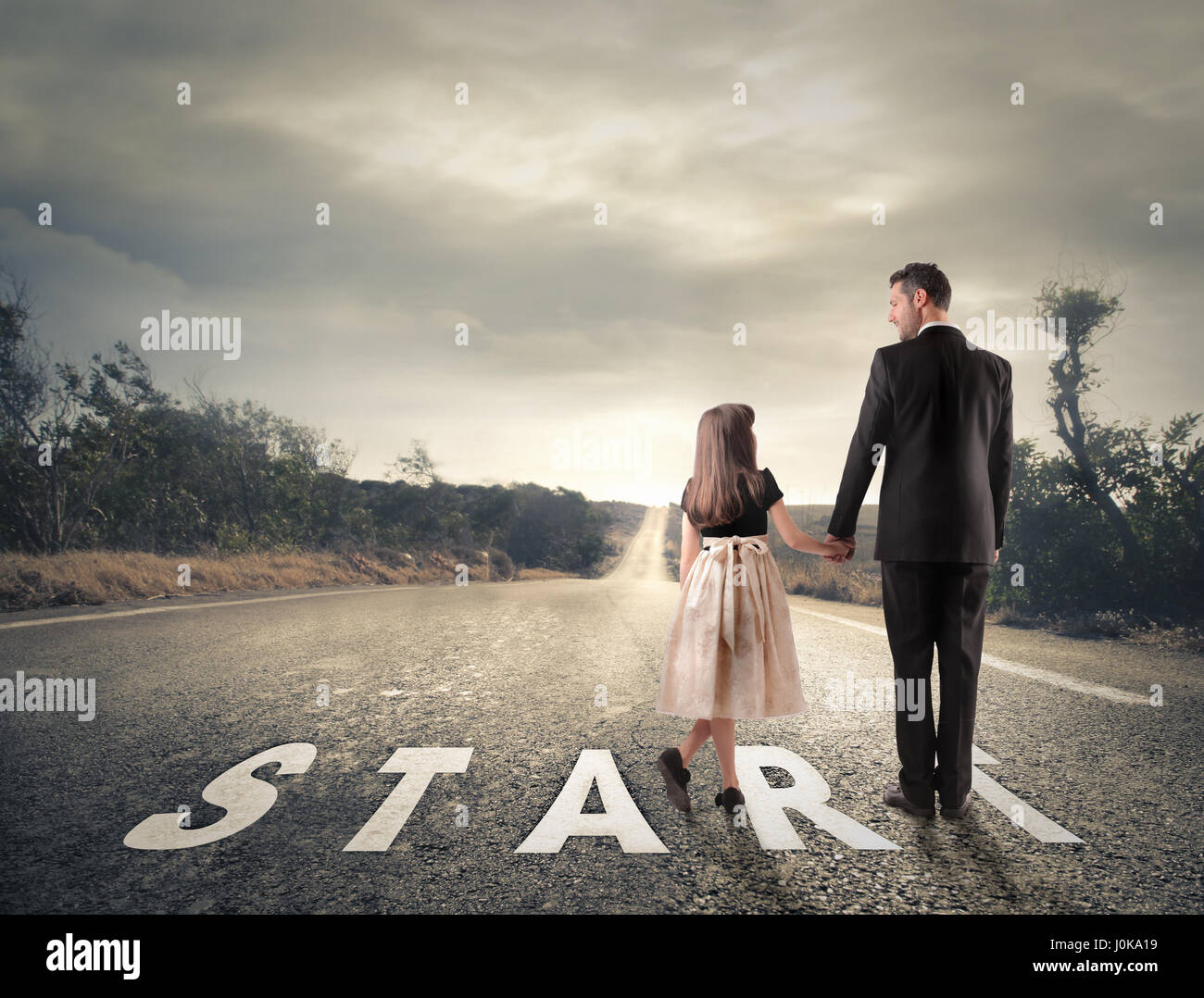 Father and daughter at start lane Stock Photo - Alamy