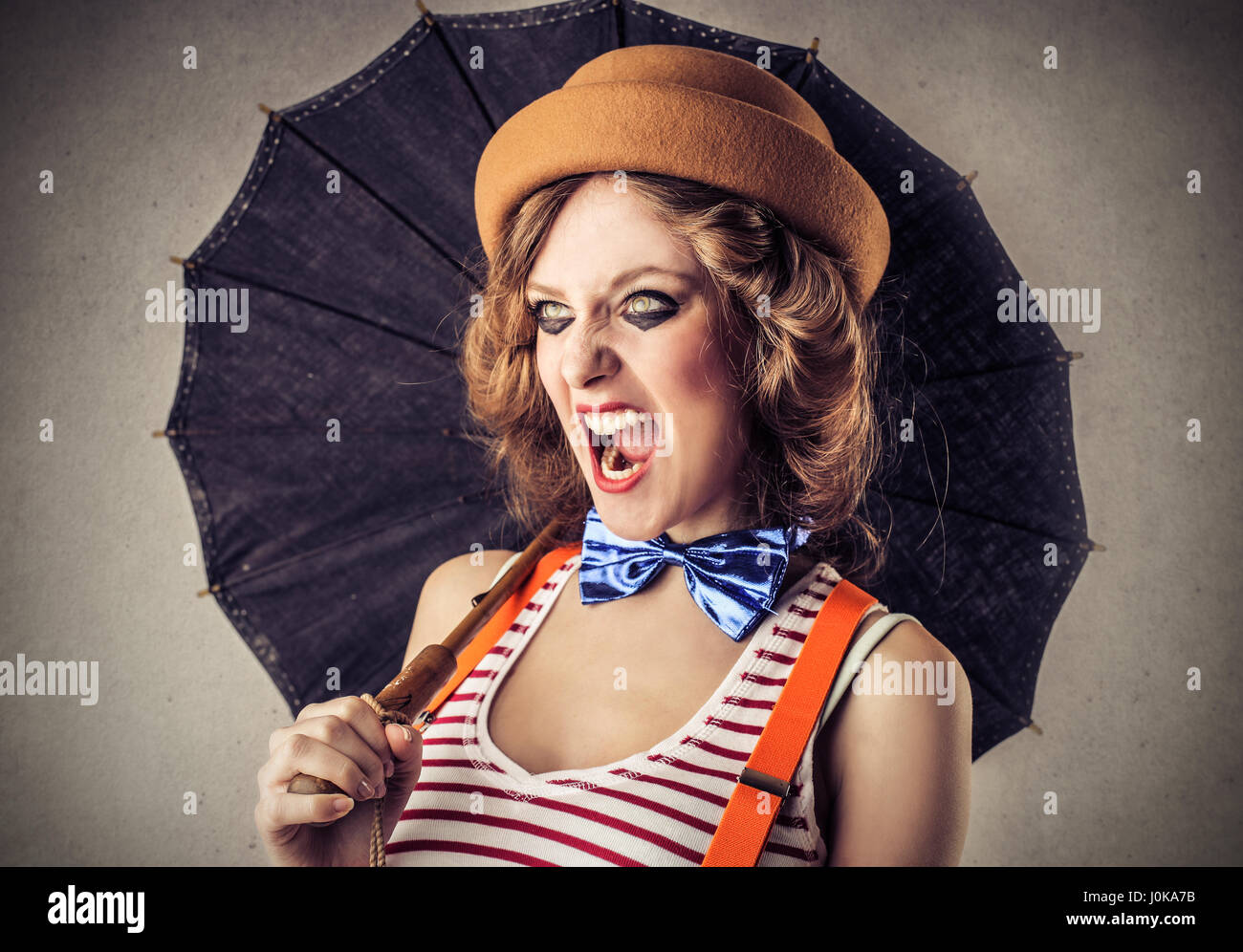 Blond clown woman making angry face Stock Photo - Alamy