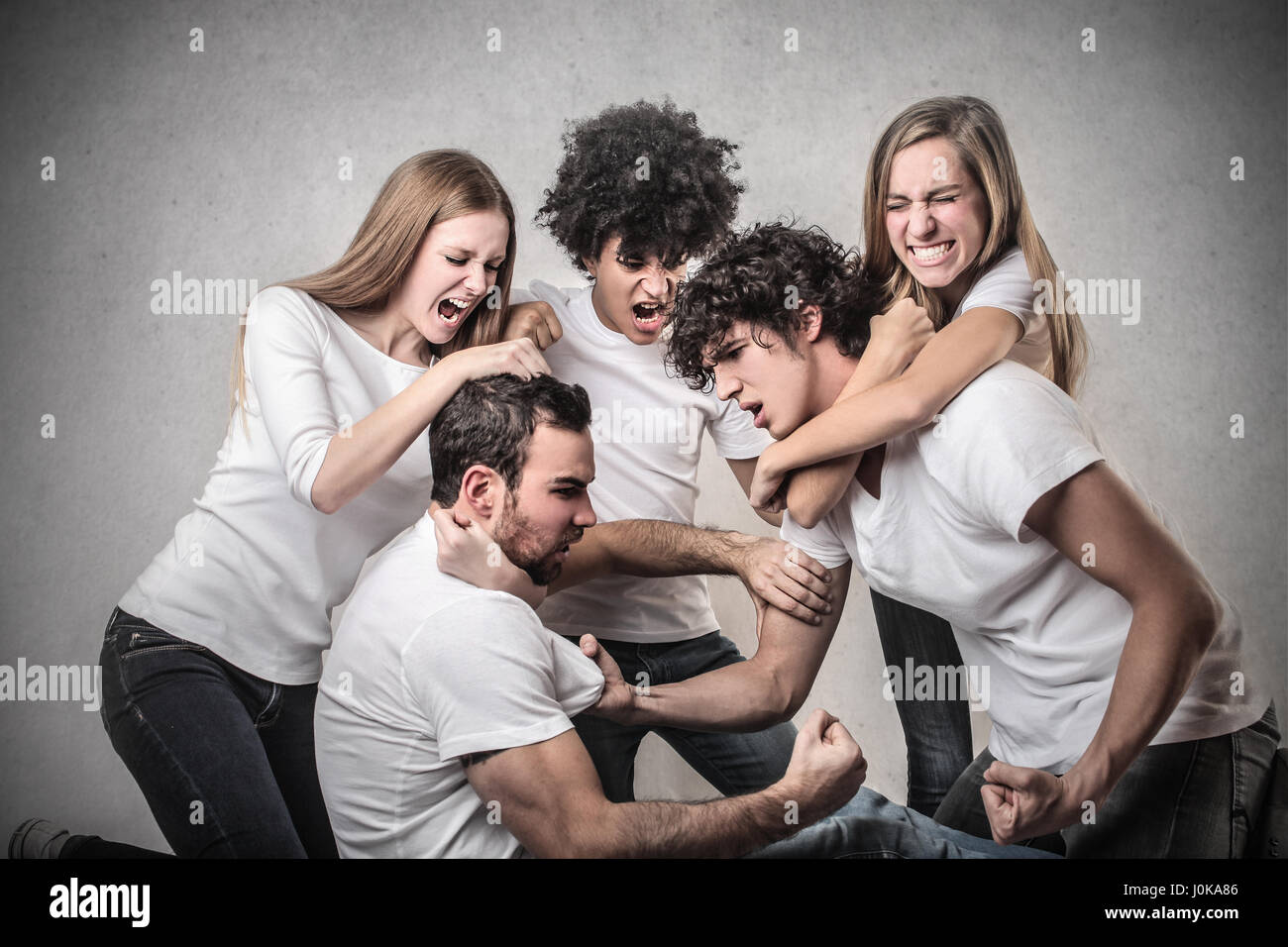 5 friends arguing and fighting Stock Photo - Alamy