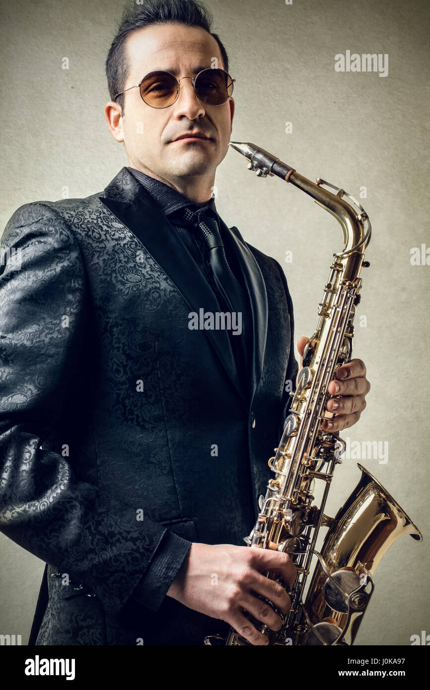 Cool man with saxophone Stock Photo - Alamy