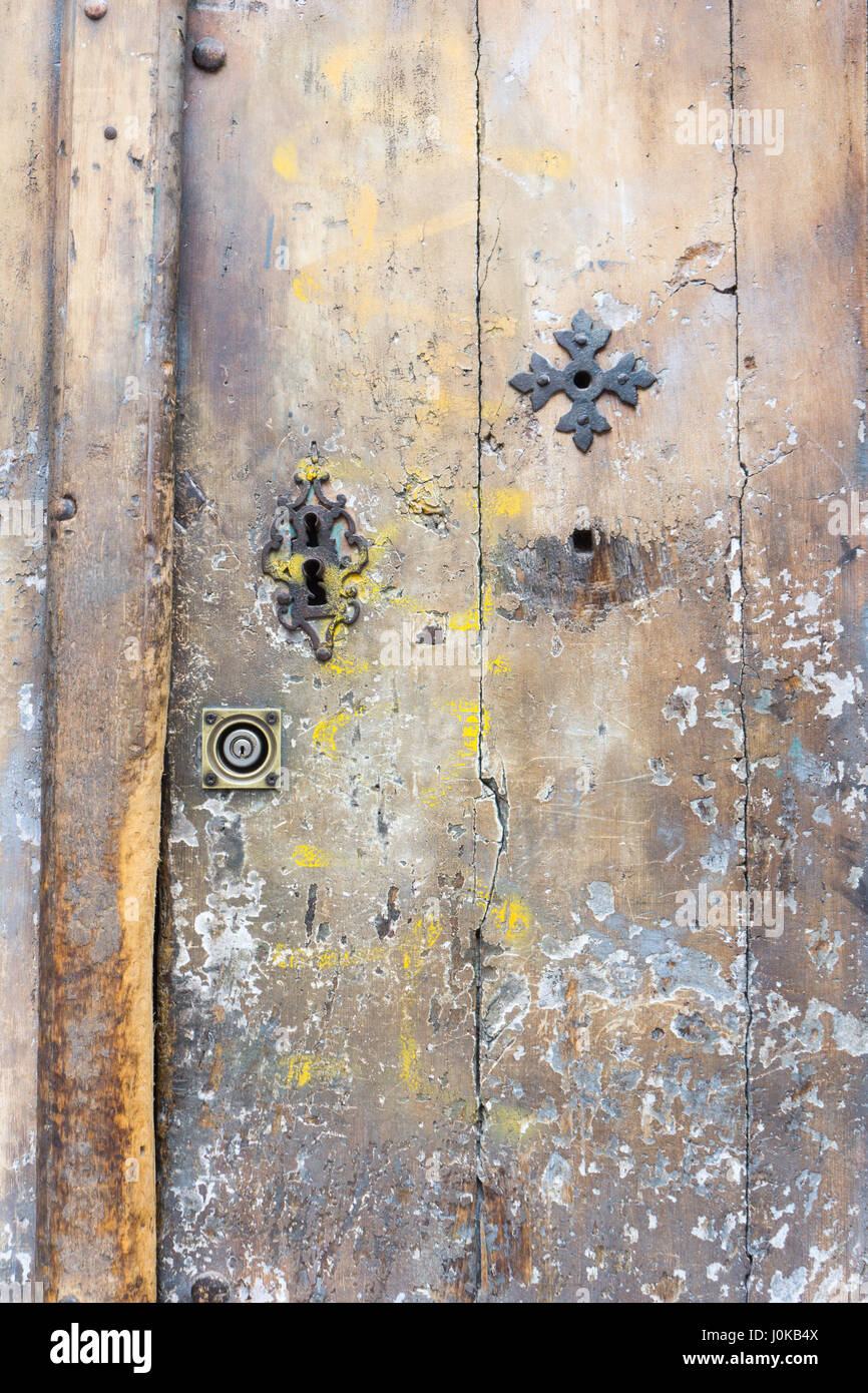 Faded worn old door with key holes Stock Photo - Alamy