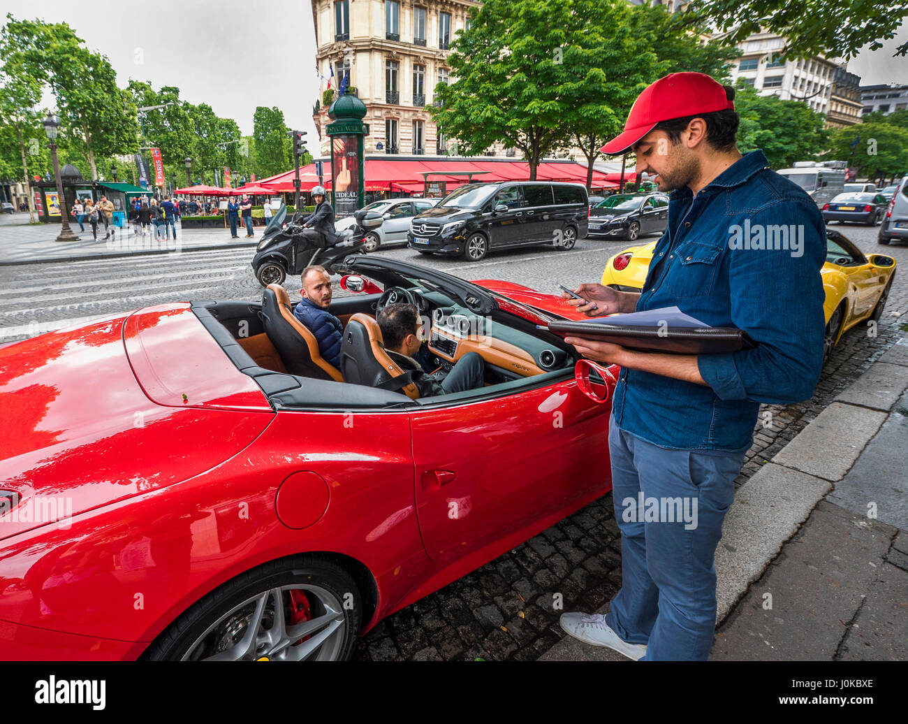 Ferrari test drive at Champs Élysées Stock Photo - Alamy