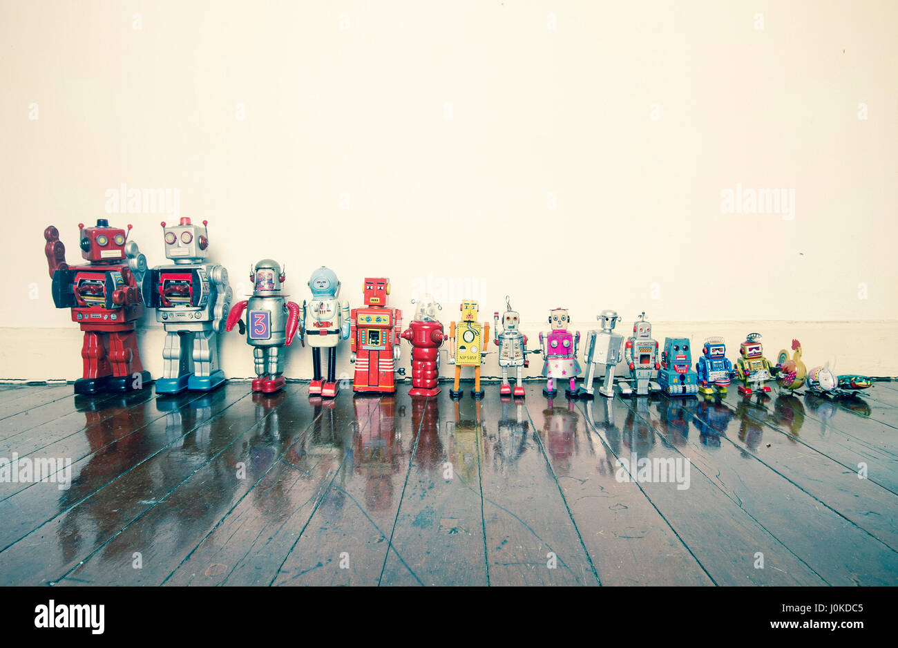 a line of vintage robots from small to big Stock Photo - Alamy