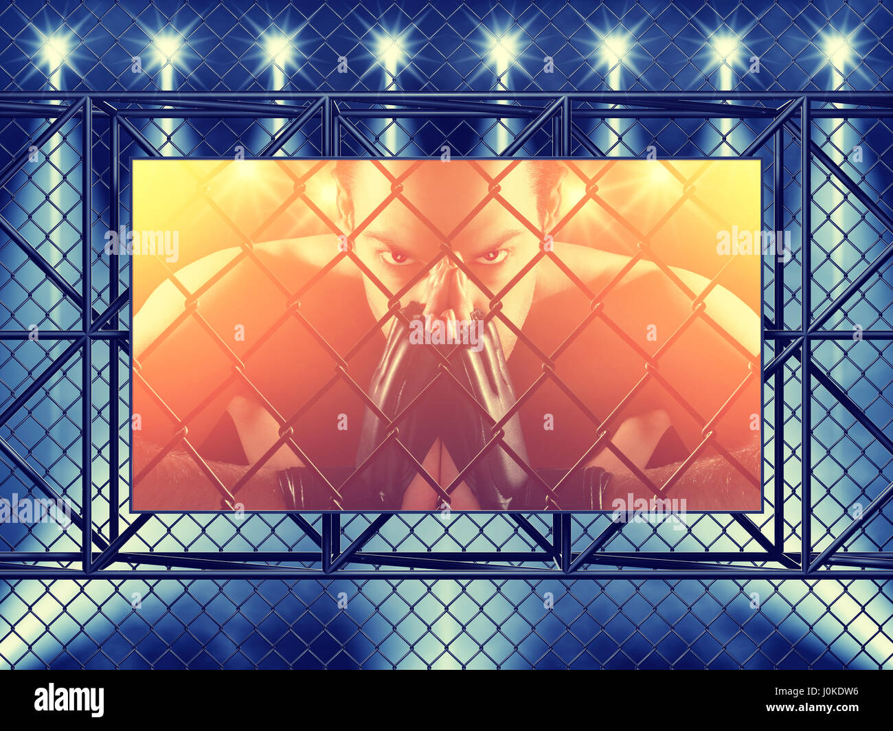 Display with MMA fighter staring , chainlink fence and spotlights ...