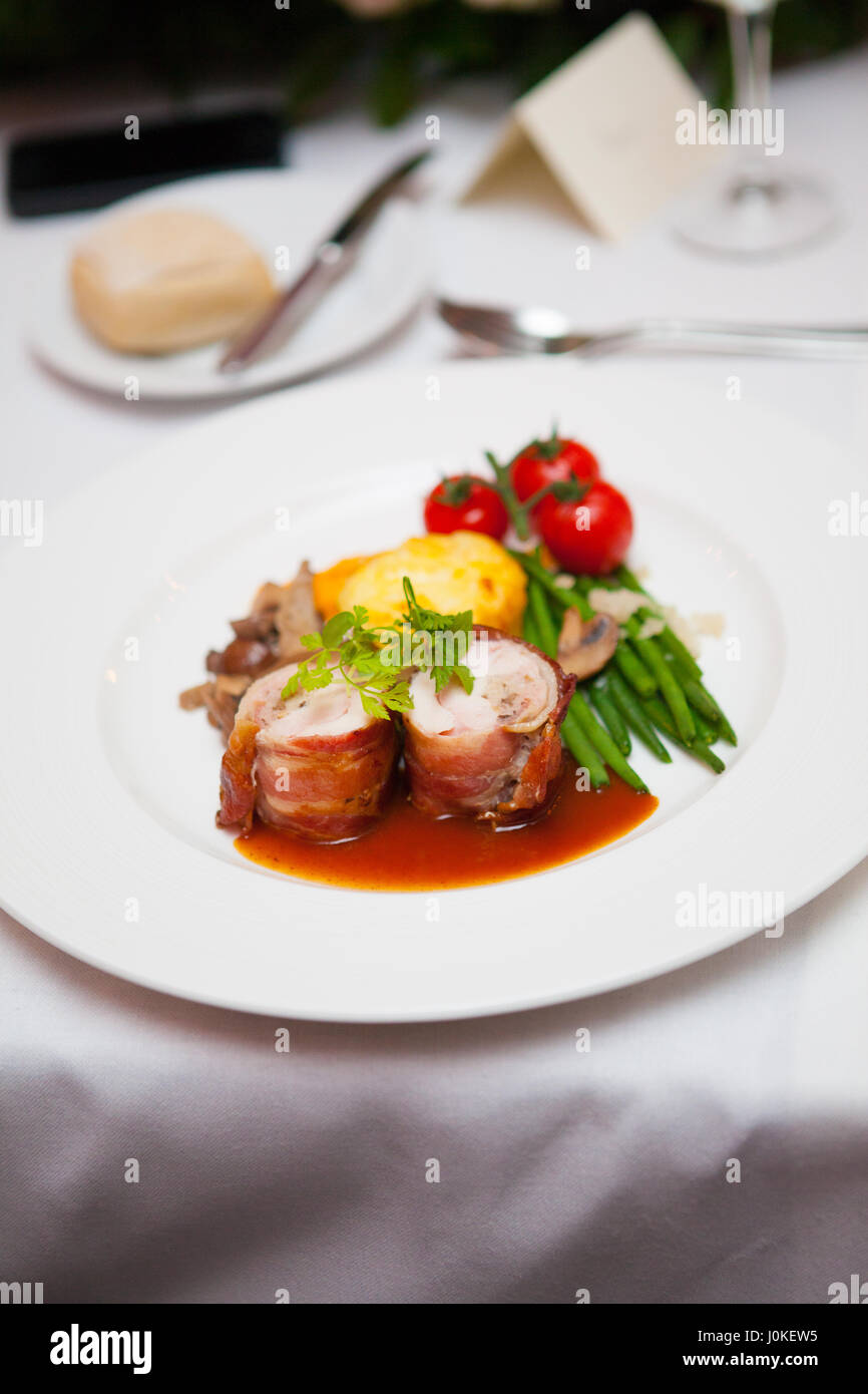 Very tasteful dinner in a restaurant with cherry tomatoes, meat, mashed ...