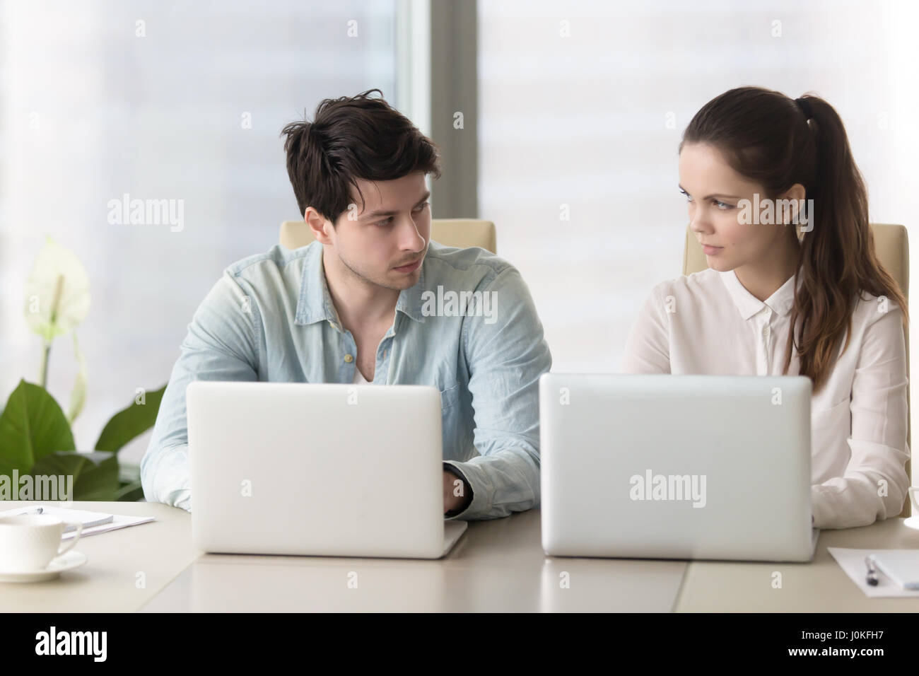 Rivalry between male and female colleagues, angry coworkers look Stock ...