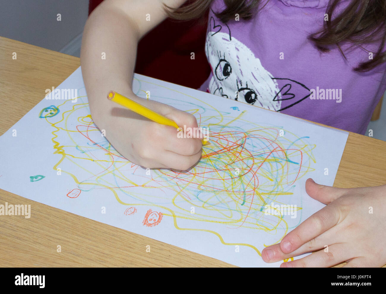 Young child doodling with a crayon Stock Photo - Alamy