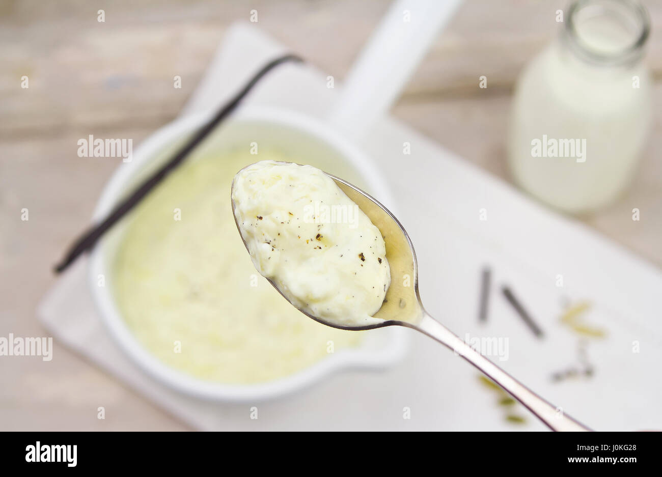 Plain porridge with spoon on table hi-res stock photography and images ...