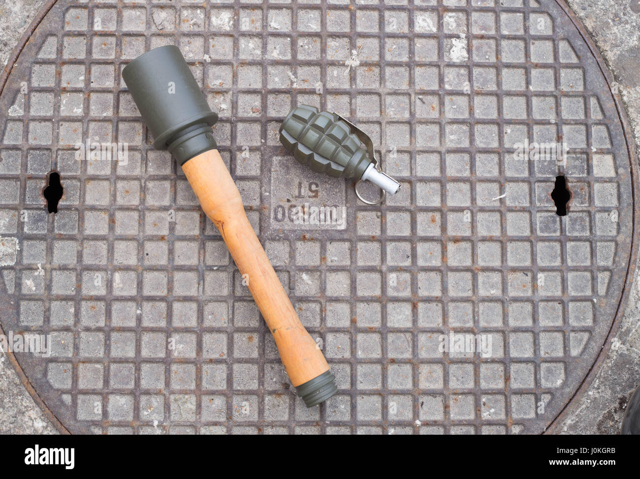 Two kinds of grenades lying on the ground Stock Photo - Alamy