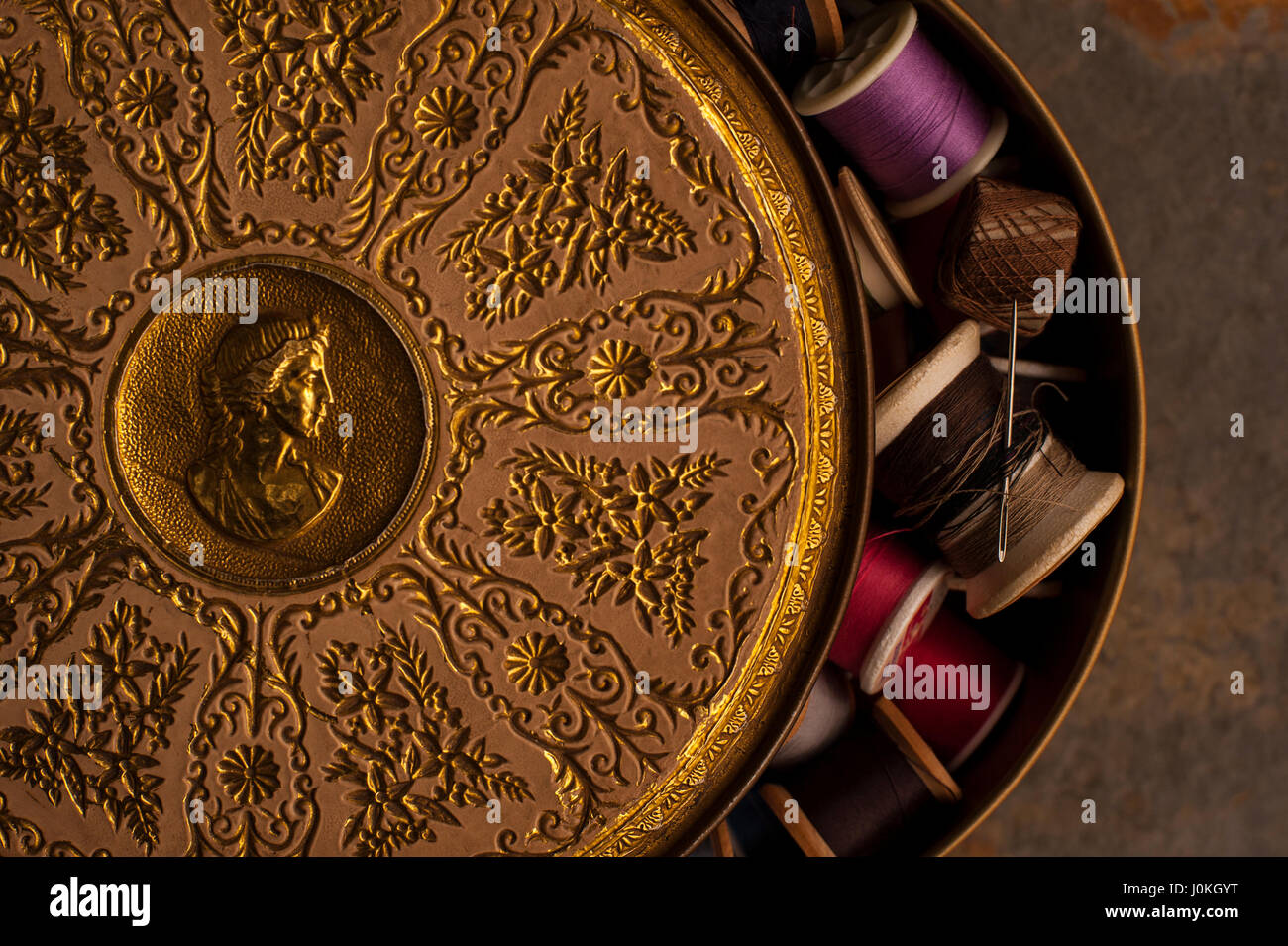 Multi colored thread in tin container Stock Photo - Alamy