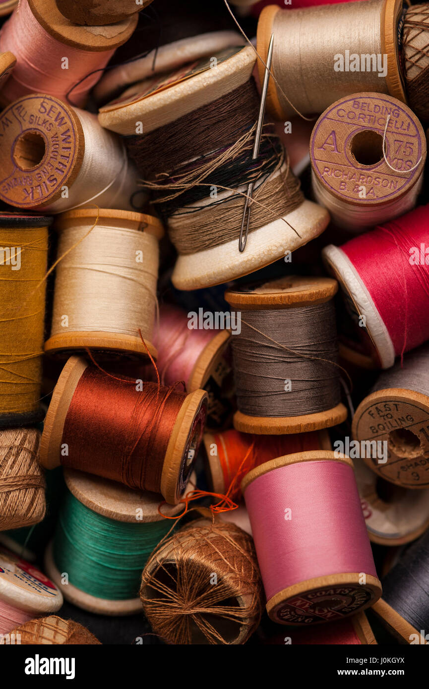 Multi colored thread in tin container Stock Photo - Alamy