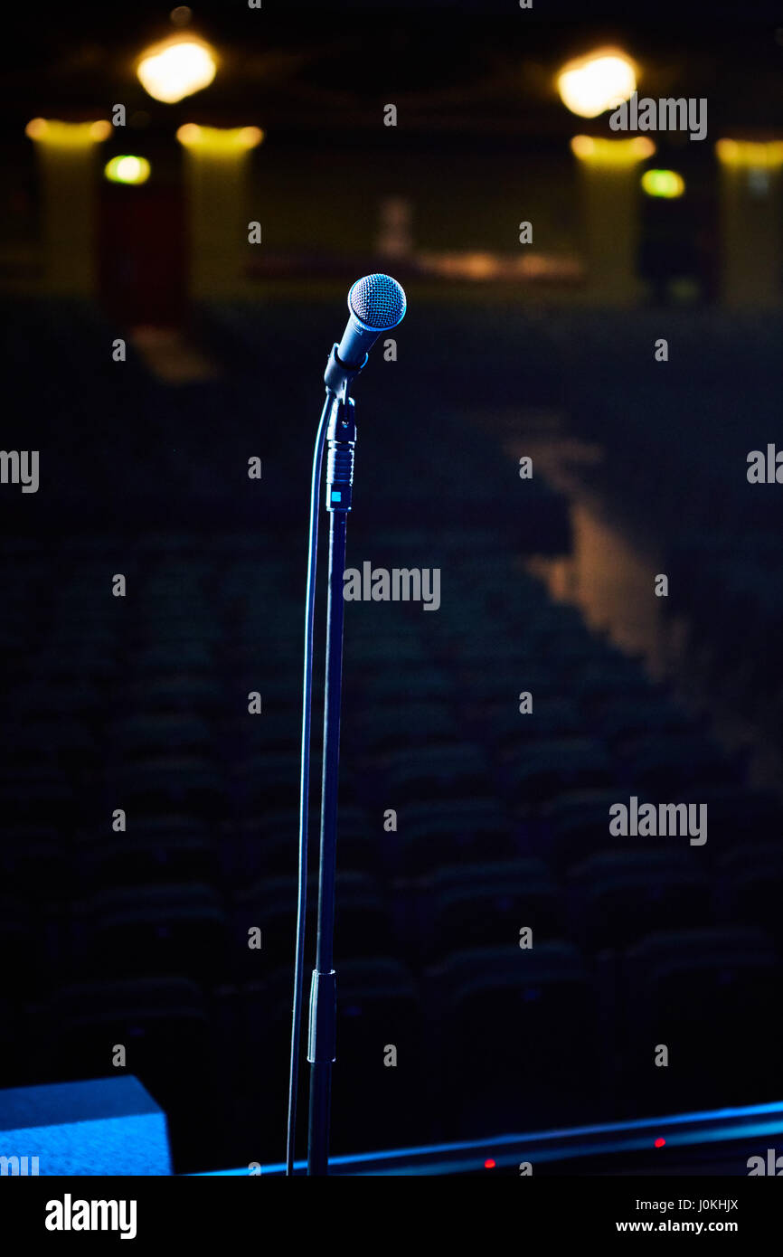 Microphone on stage Stock Photo - Alamy