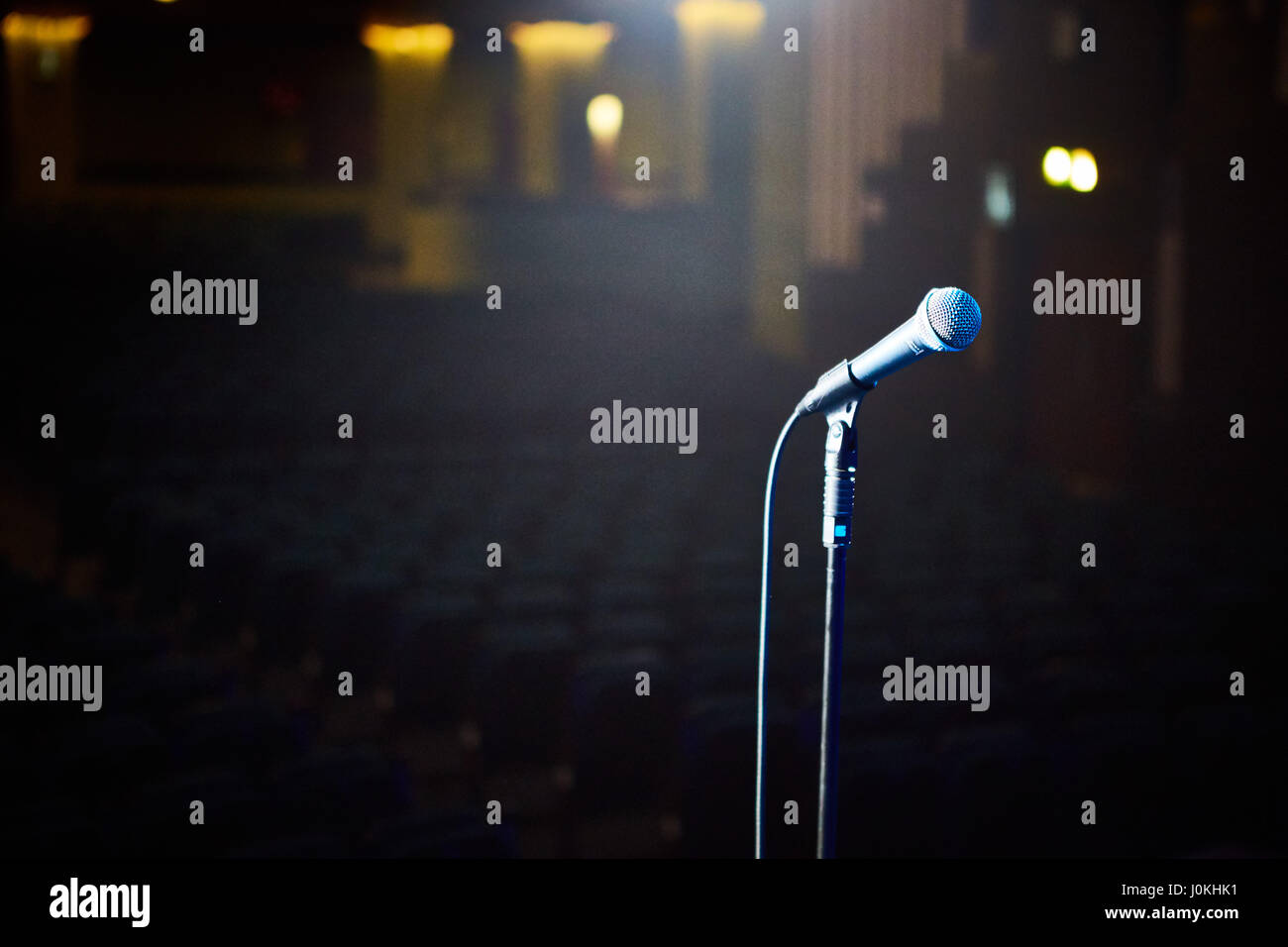 Microphone on stage Stock Photo - Alamy