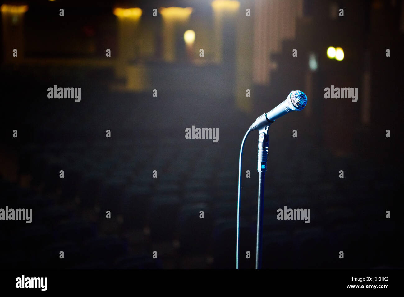 Microphone on stage Stock Photo - Alamy