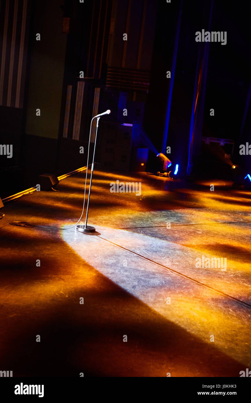 Microphone on stage Stock Photo - Alamy