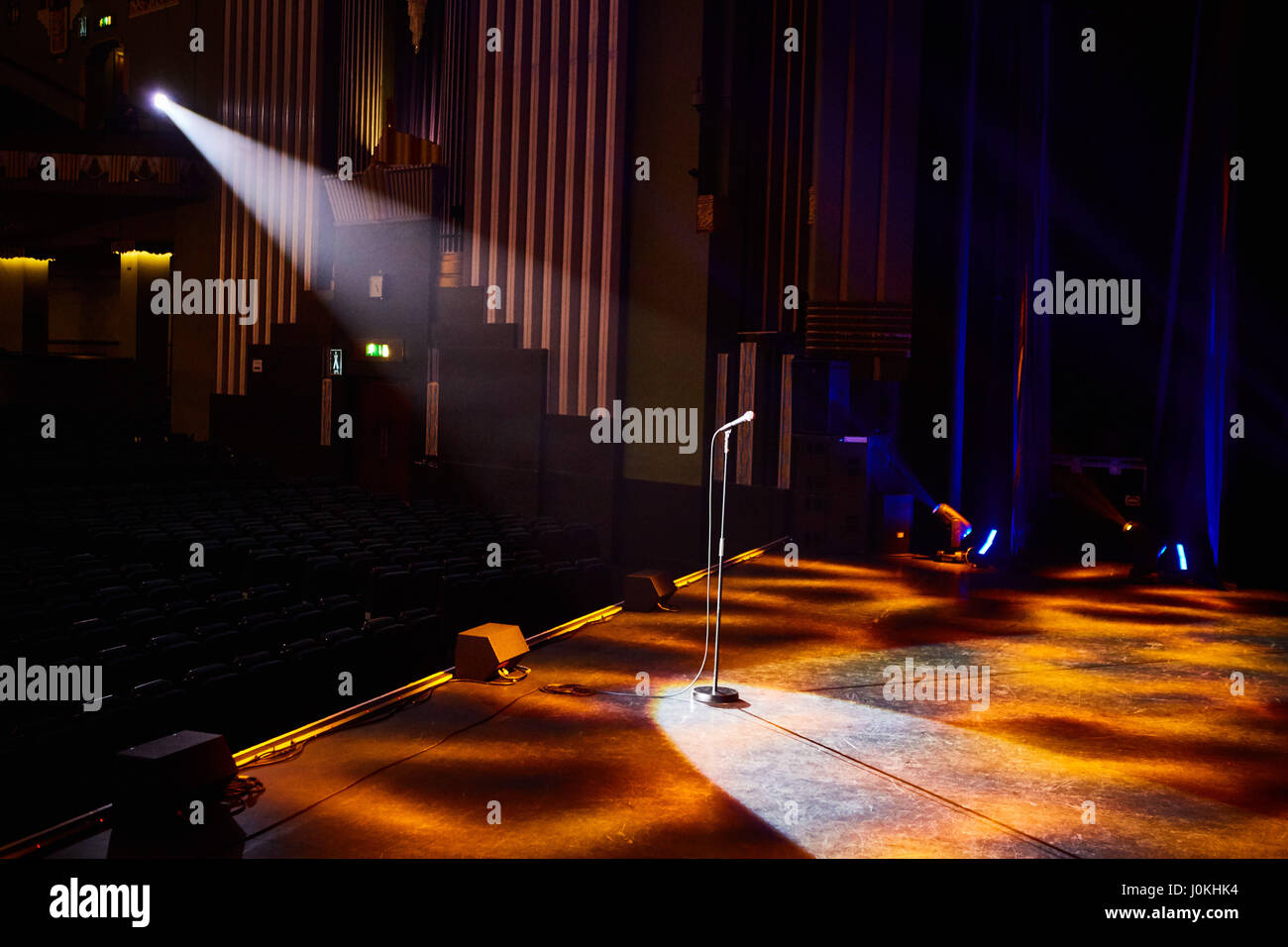 Microphone on stage Stock Photo - Alamy