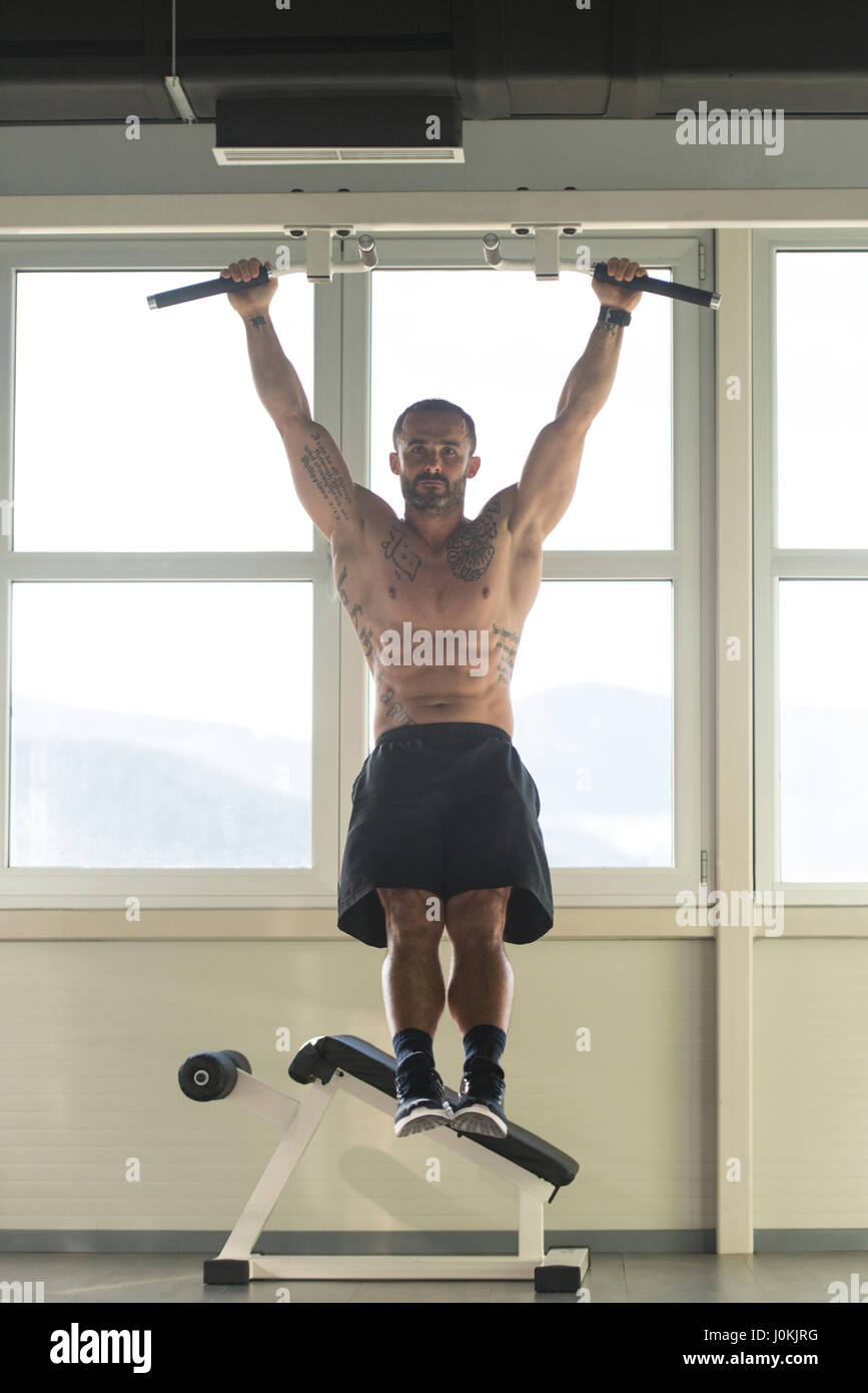 Athlete Performing Hanging Leg Raises Exercise - One Of The Most ...