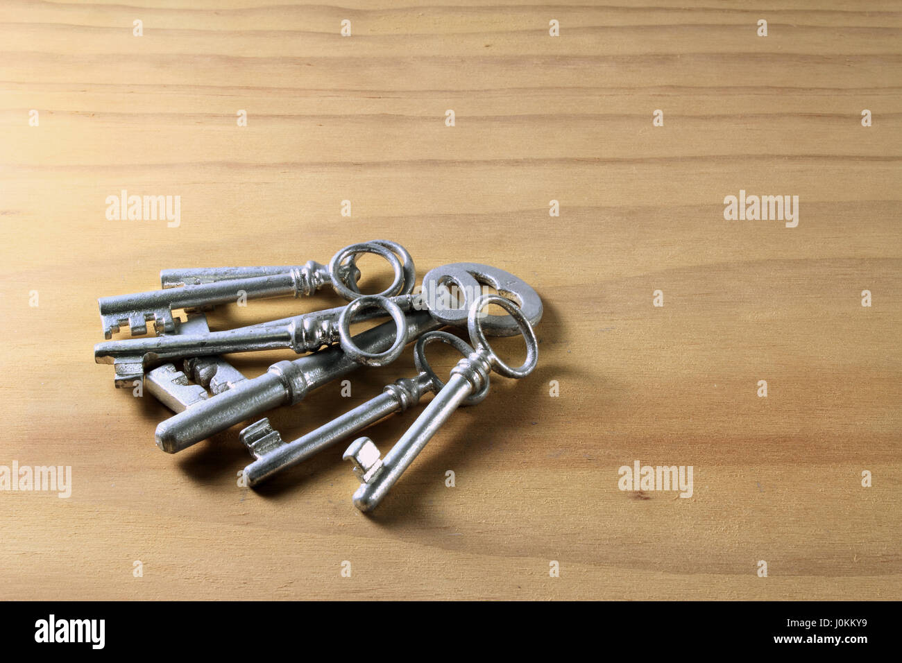 Skeleton Keys on Wooden Background Stock Photo - Alamy