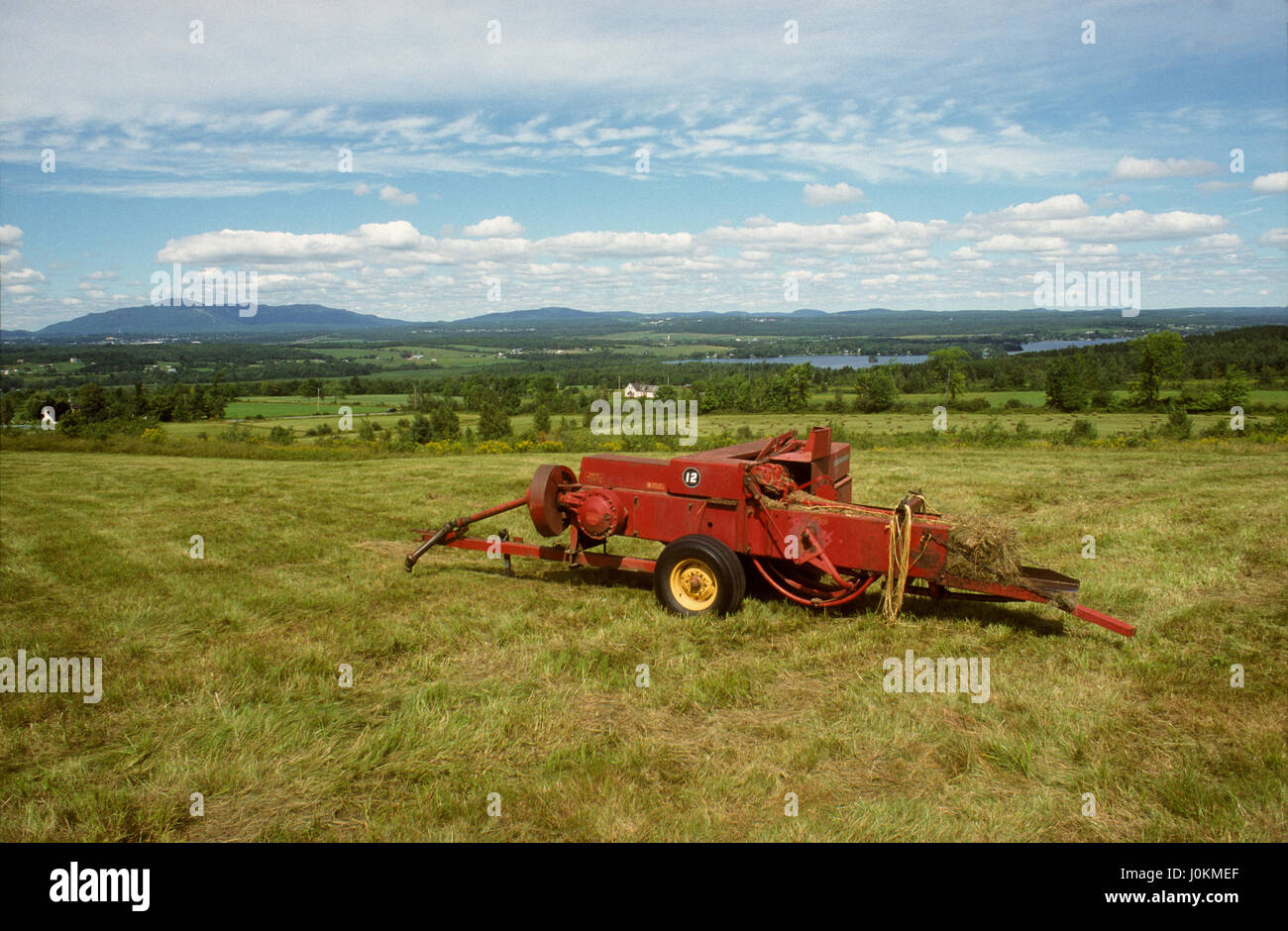 Hay baler in field, Katevale, Quebec, Canada Stock Photo - Alamy