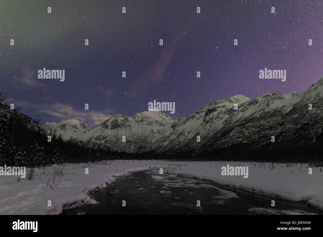 Diffuse aurora colors paint the night sky above Eagle and Polar Bear ...