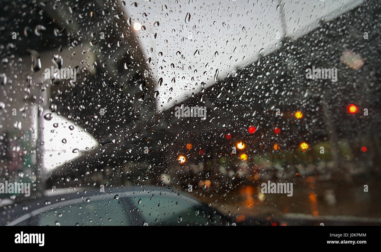 Rain drops on the car window. Blurry background. New Orleans. Driving ...