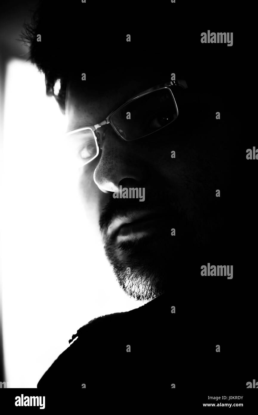 portrait of bespectacled young man Stock Photo - Alamy