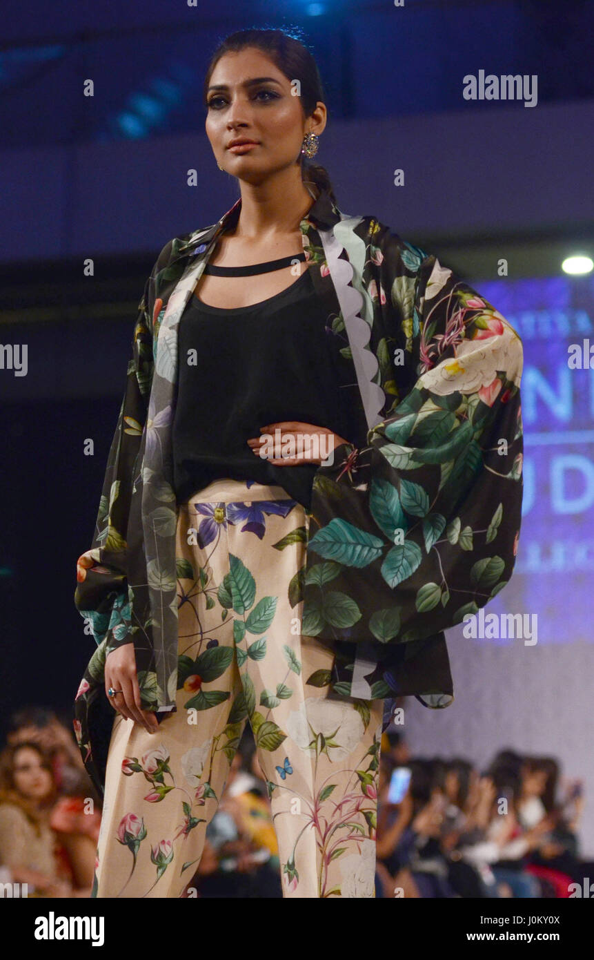 A Pakistani model presents a creation by a famous fashion designer Amina Sheikh on the first day ...