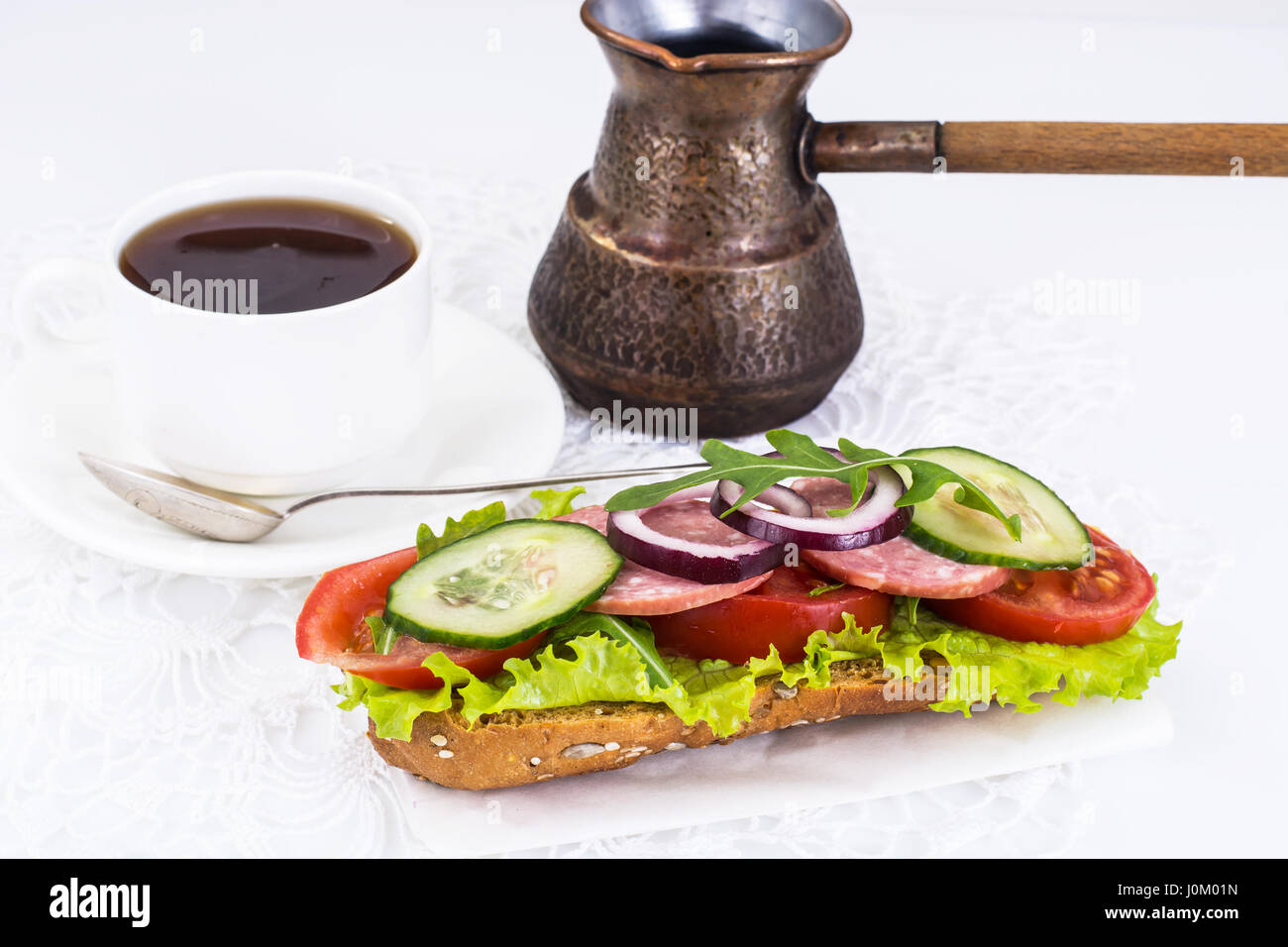 Breakfast sandwich with vegetables and ham, tea, coffee. Studio Photo ...