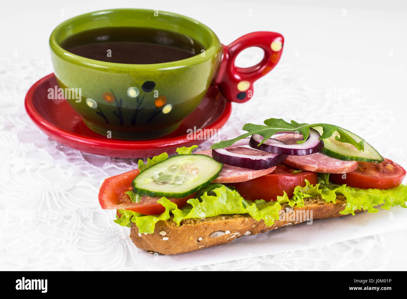 Breakfast sandwich with vegetables and ham, tea, coffee. Studio Photo ...