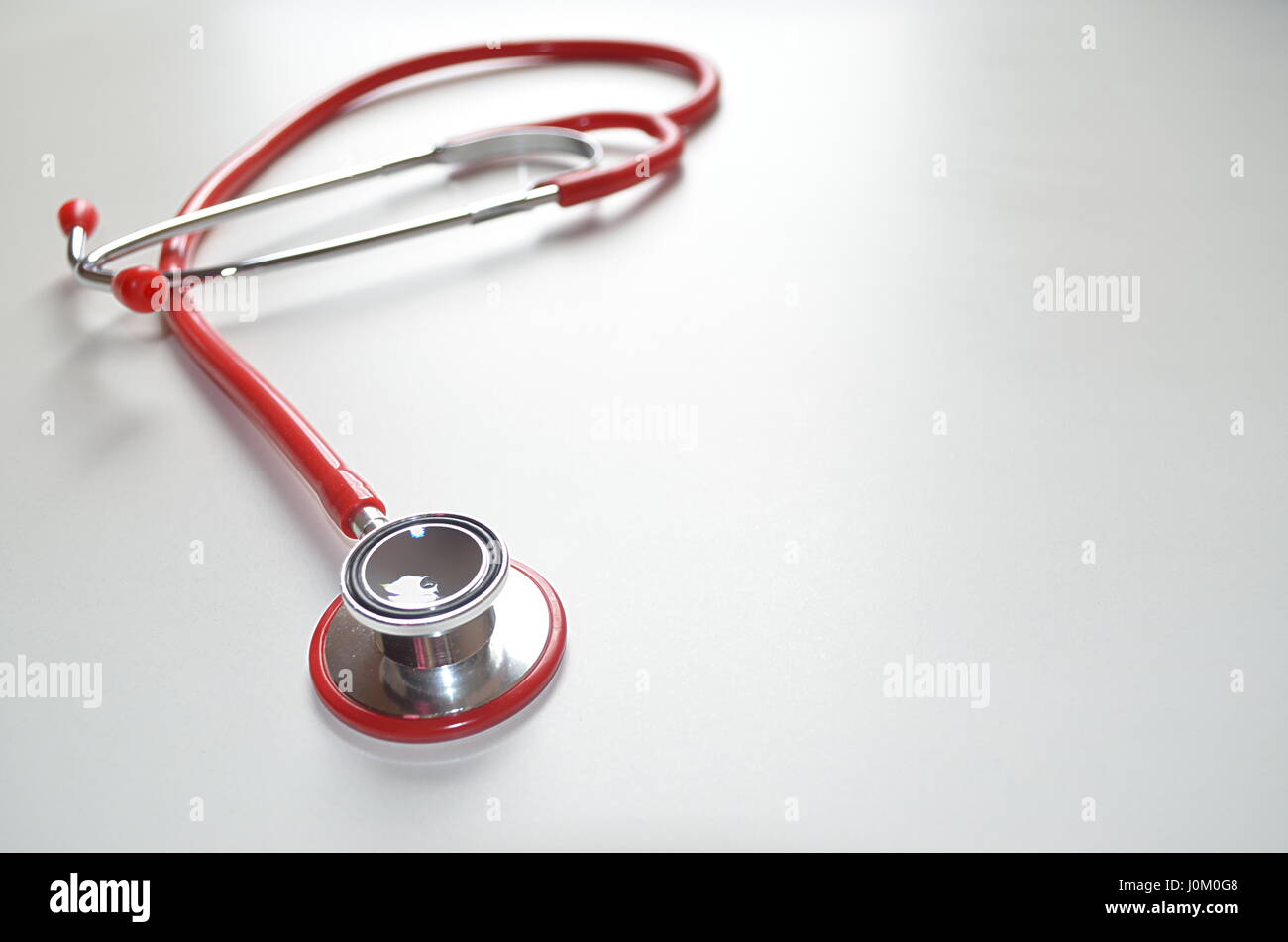 One red stethoscope isolated on white background Stock Photo - Alamy
