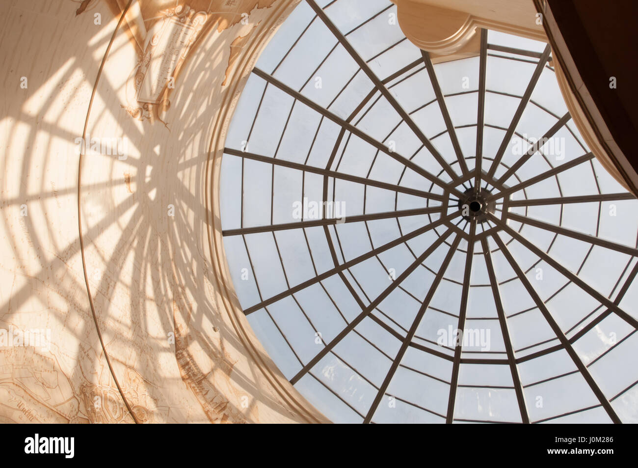 Glass roof round shape with shadow on the wall and blue sky sunny day ...