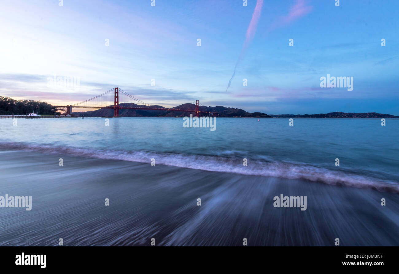 Beach and Golden Gate bridge at sunset - San Francisco, California, USA ...
