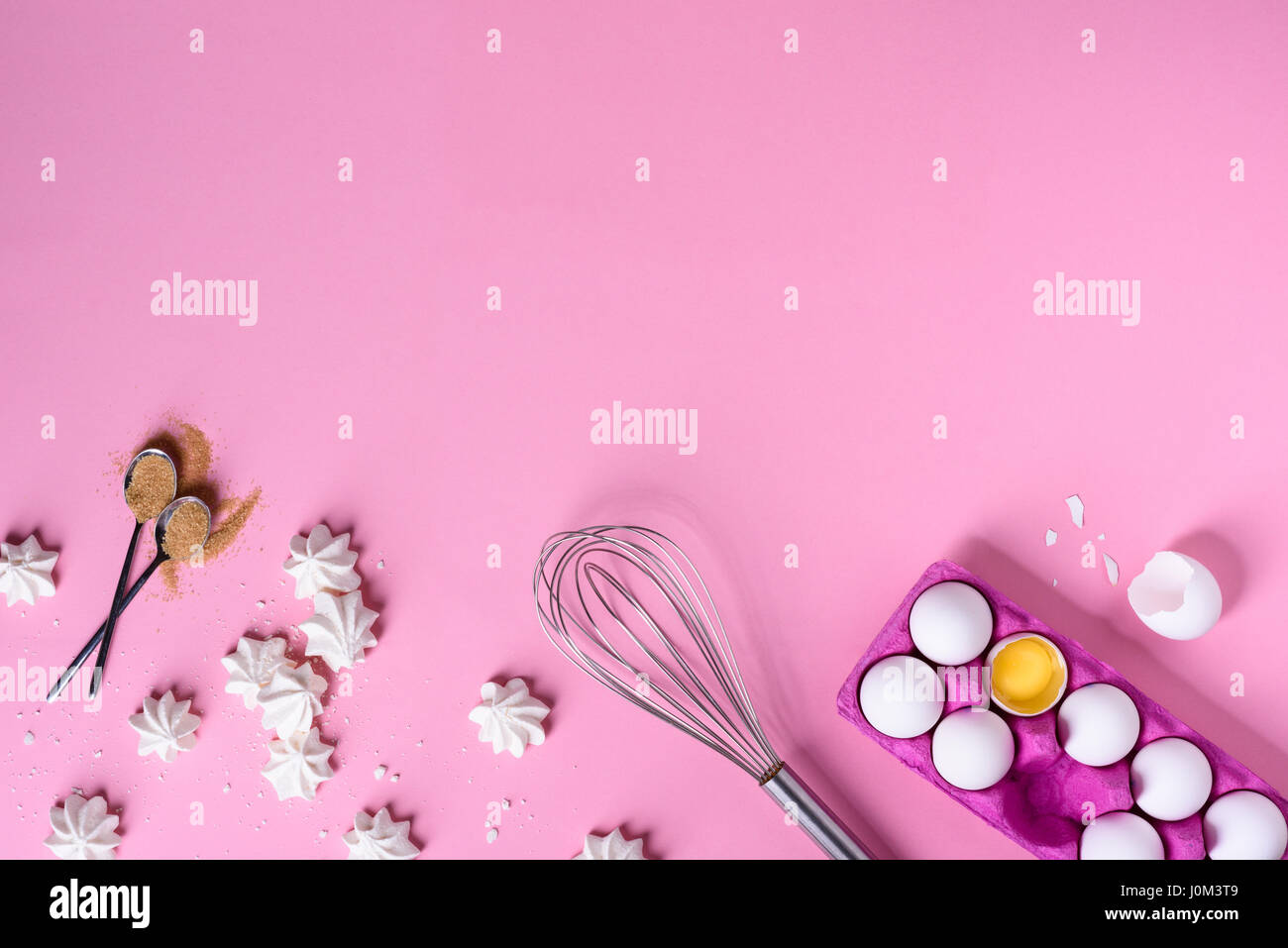 Bakery background frame. Cooking ingredients - egg, sugar, over pink ...