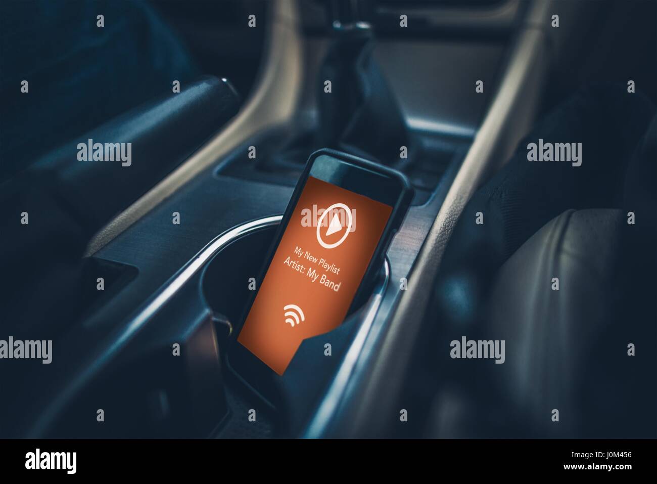 Music in the Car While Driving. Mobile Phone Wirelessly Connected to ...