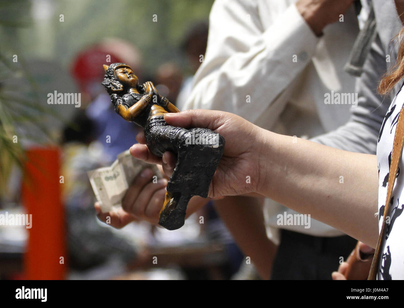 Delhi, India. 14th Apr, 2017. People purchasing Dr. Ambedkar posters ...