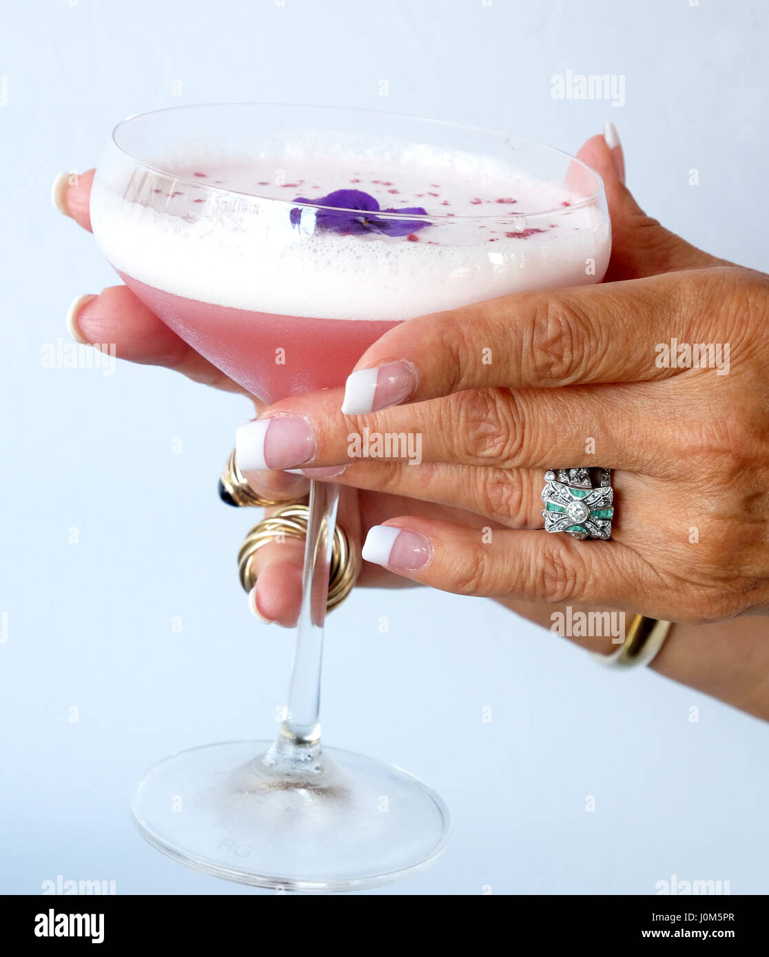 Cocktail with woman's hands Stock Photo - Alamy