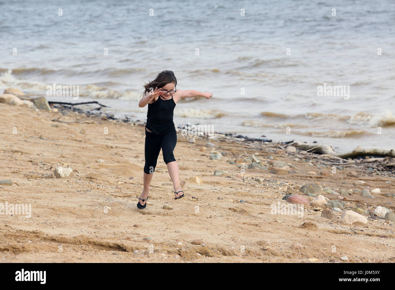 Black child skipping rock hi-res stock photography and images - Alamy