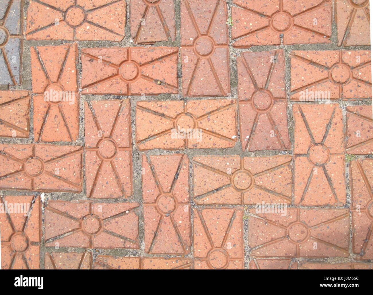 Orange colored patterned pavement Stock Photo - Alamy