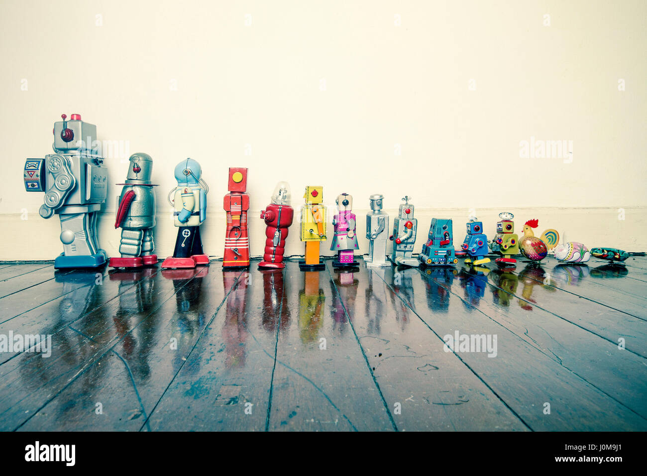 a line of vintage robots from small to big Stock Photo - Alamy