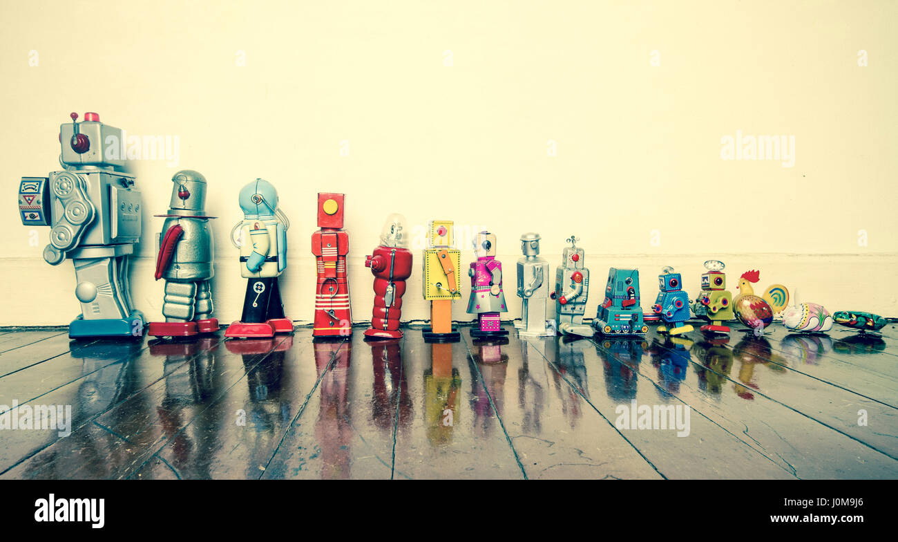 a line of vintage robots from small to big Stock Photo - Alamy