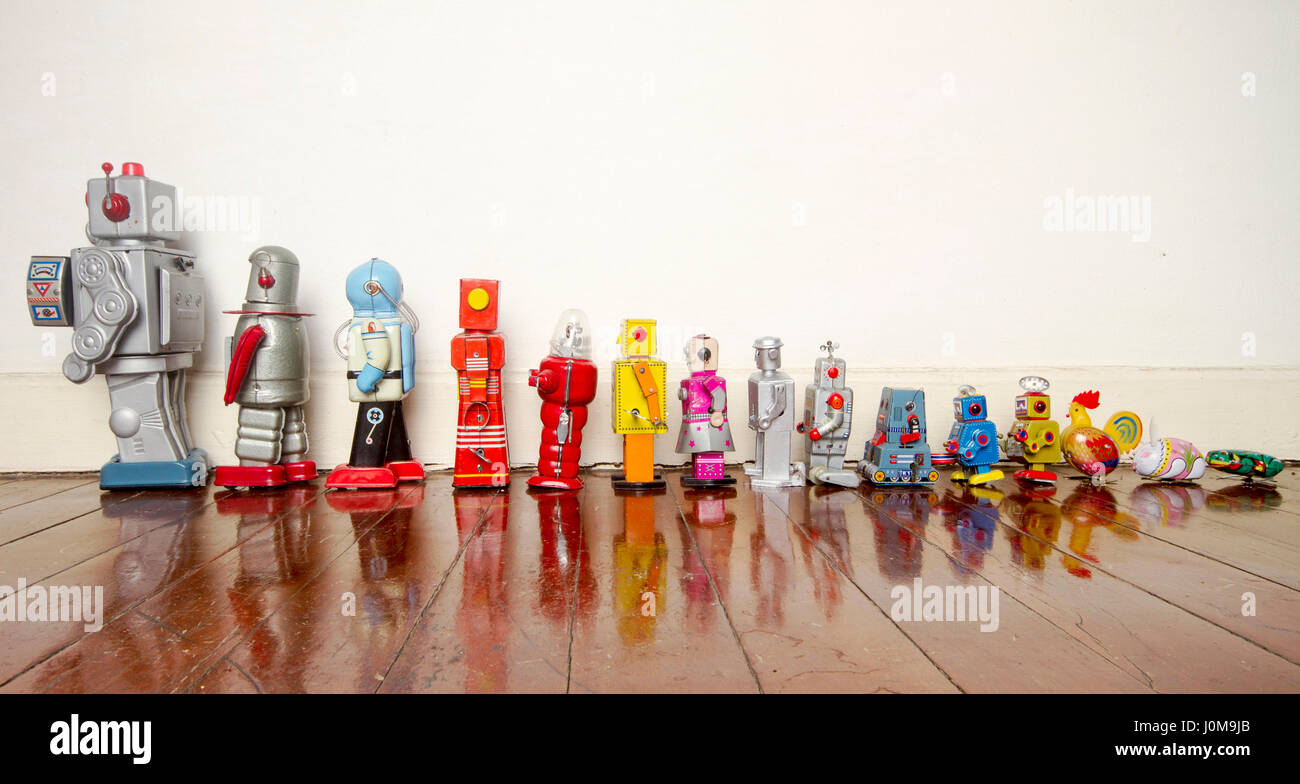a line of vintage robots from small to big Stock Photo - Alamy
