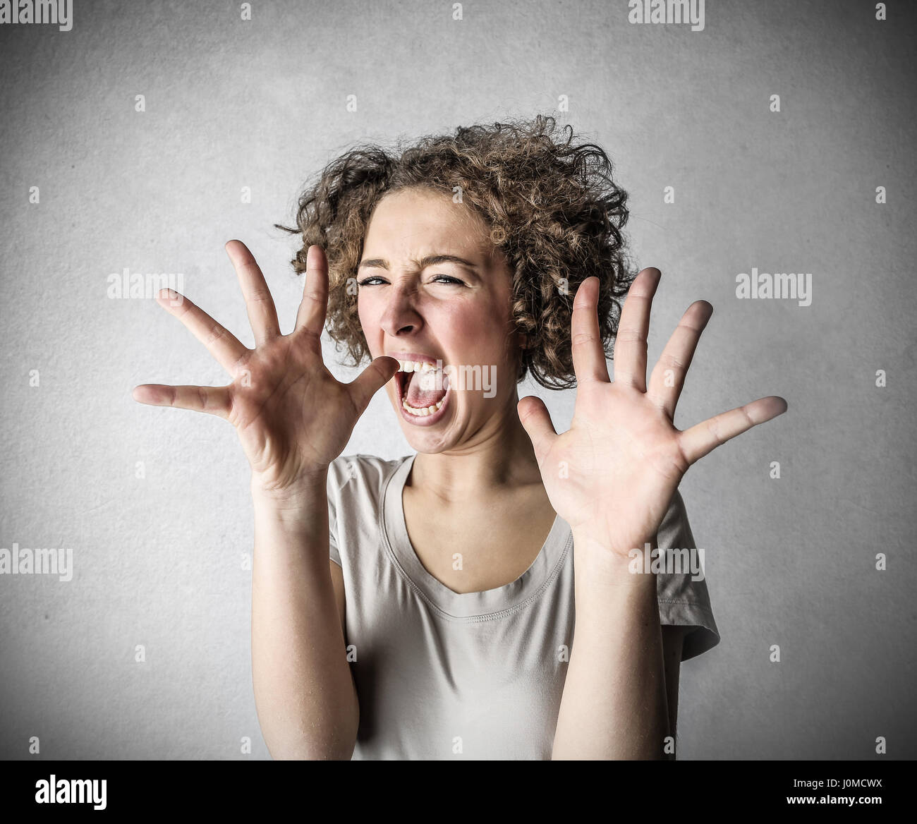Brunette woman screaming Stock Photo - Alamy