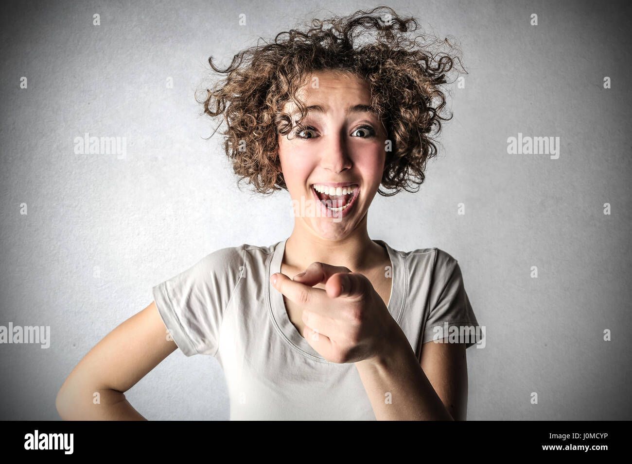 Brunette woman making a joke Stock Photo - Alamy